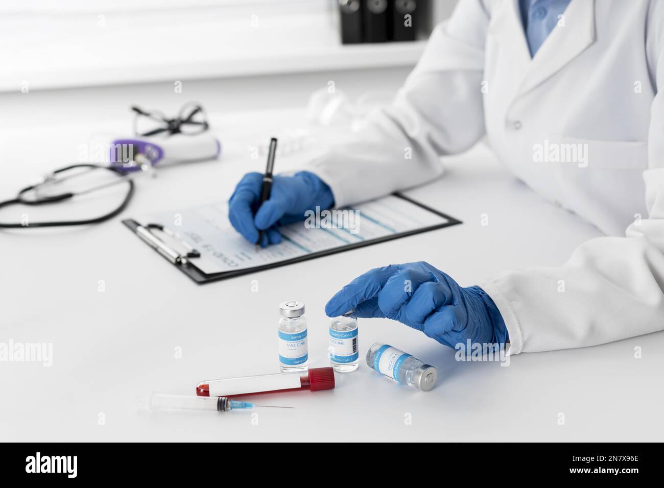 doctor completing covid medical form Stock Photo - Alamy
