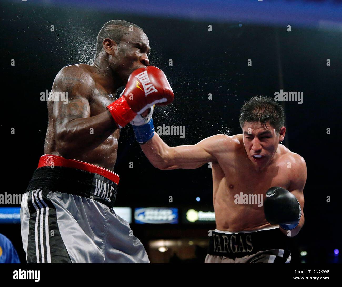 Jesse Vargas, right, punches Wale Omotoso in the eighth round of a ...