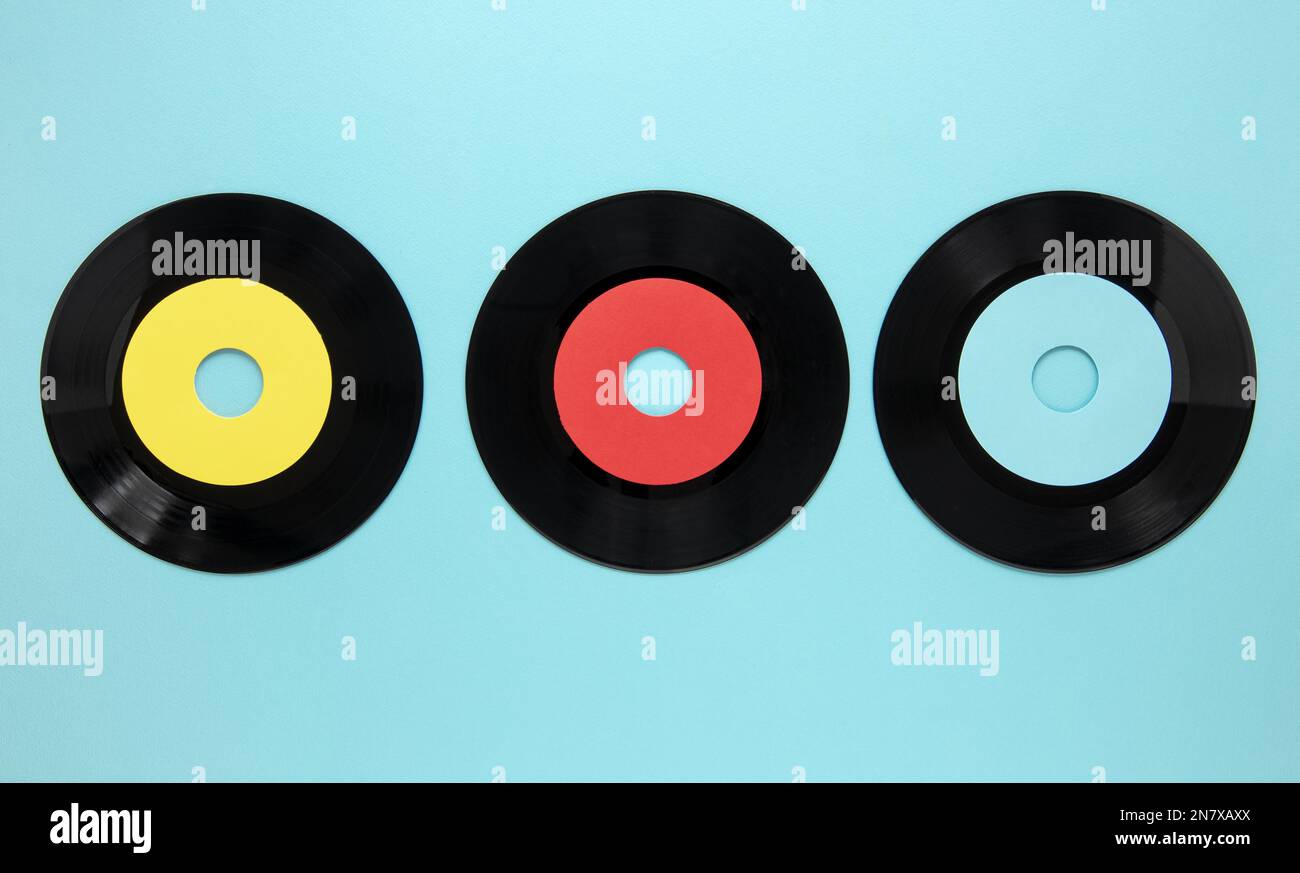 flat lay old disc records blue background Stock Photo - Alamy