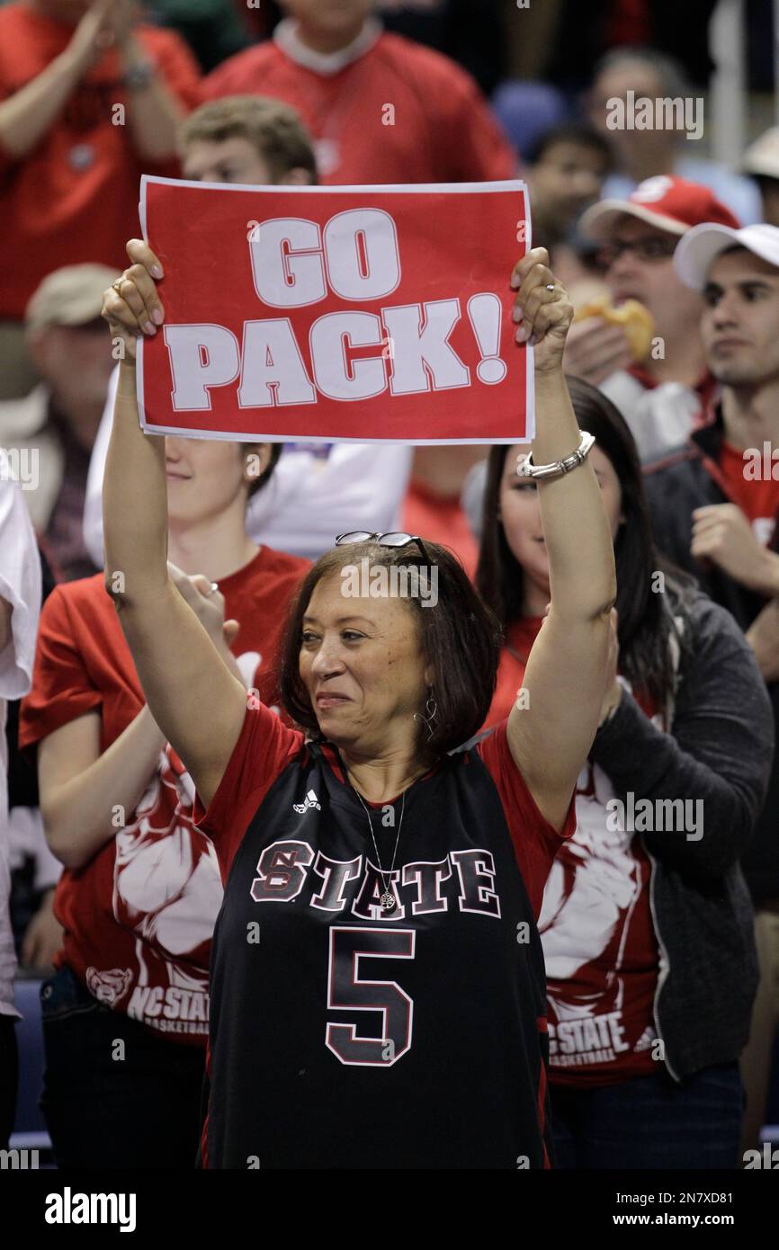 A North Carolina State fan cheers during the first half of an NCAA ...