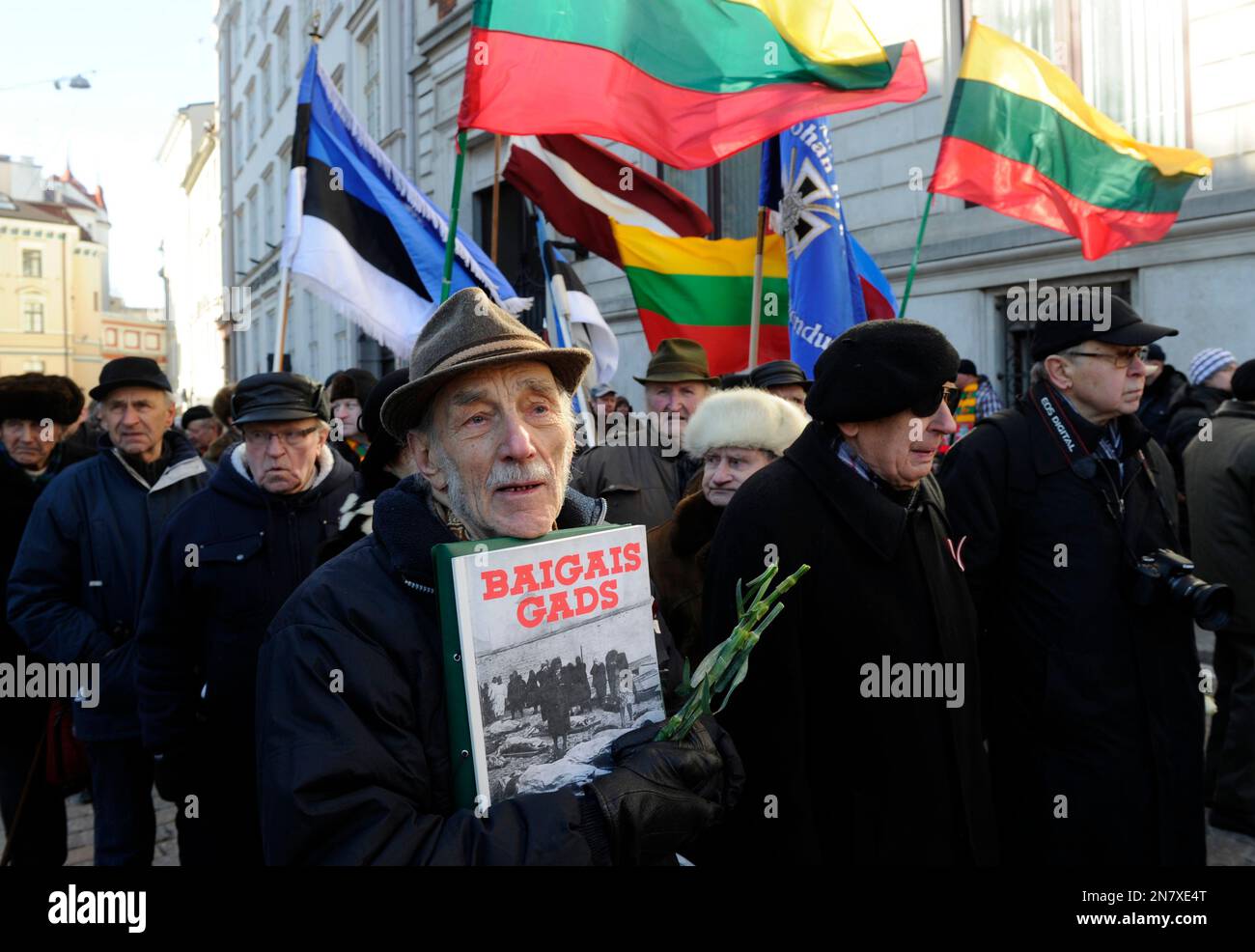 People carry Latvian, Estonian and Lithuanian flags as they march to ...