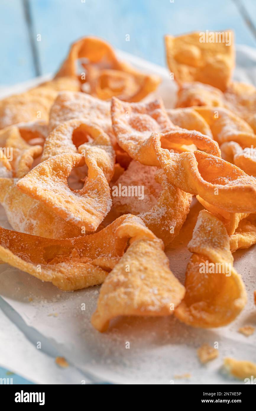 Delicious and sweet angel wings with powdered sugar. Traditional snack ...