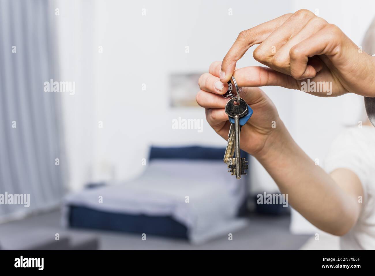 close up couple s hand holding house keys bedroom Stock Photo - Alamy
