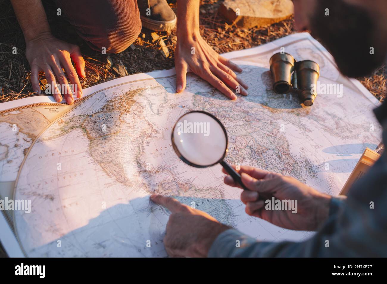 crop man exploring map Stock Photo - Alamy