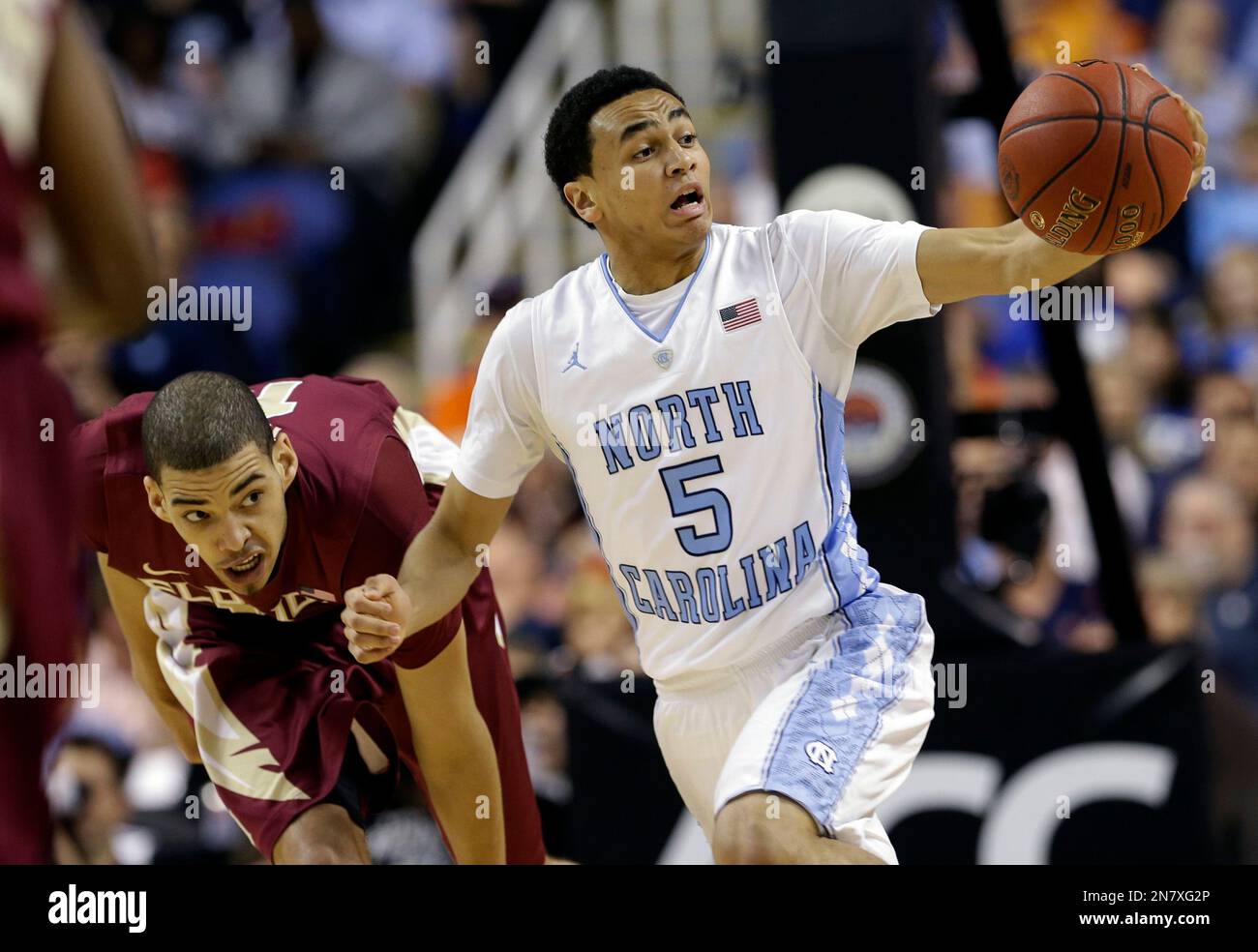North Carolina's Marcus Paige, right, grabs a loose ball as Florida ...