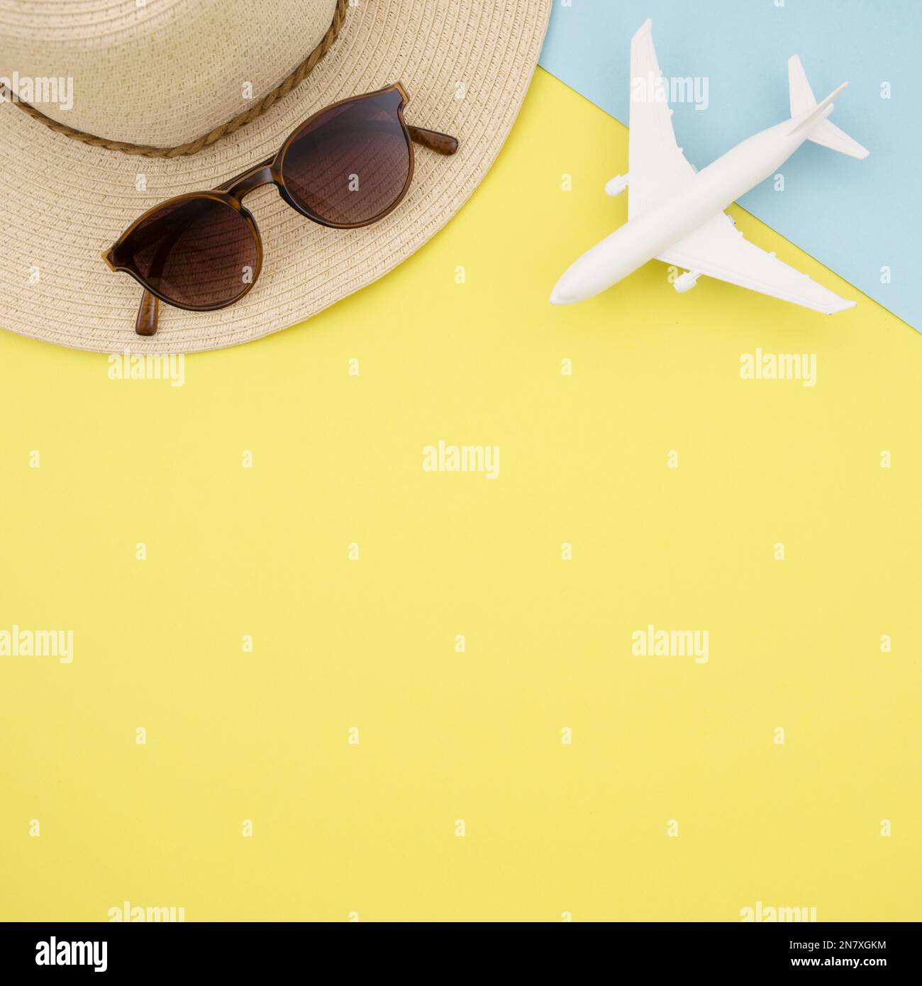 flat lay yellow background with hat glasses Stock Photo - Alamy