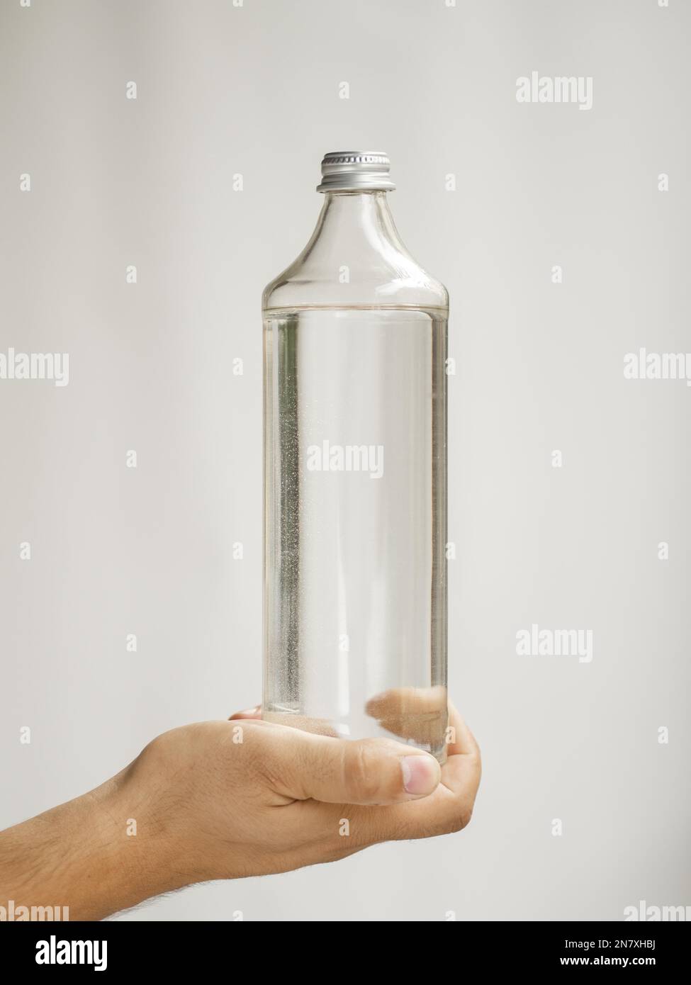 Hand holding water bottle hi-res stock photography and images - Alamy