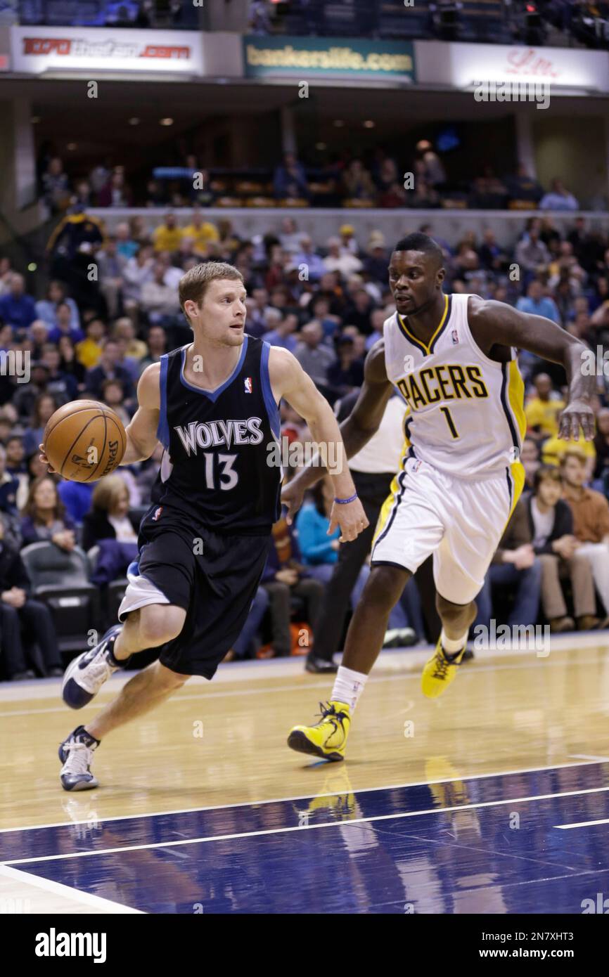 Minnesota Timberwolves guard Luke Ridnour, left, drives past Indiana ...