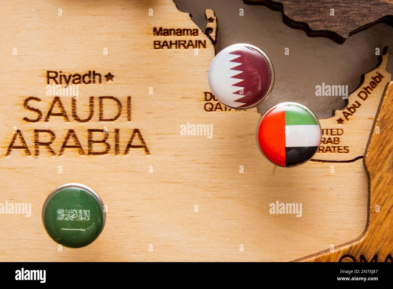 Saudi Arabia flag on the push pins on the wooden map, close up. Mark of ...