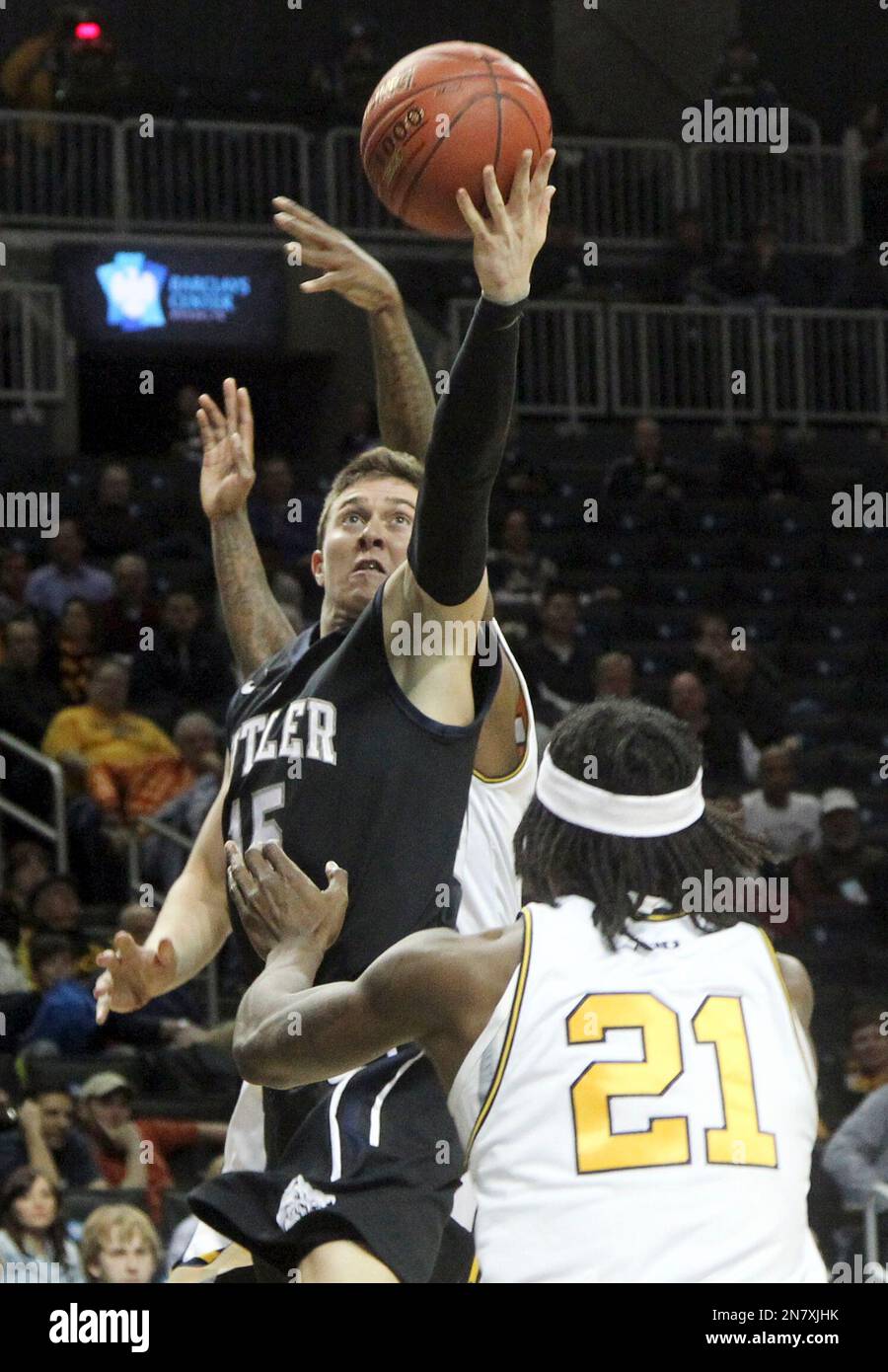Butler's Rotnei Clarke goes up past La Salle's Tyrone Garland (21) and ...