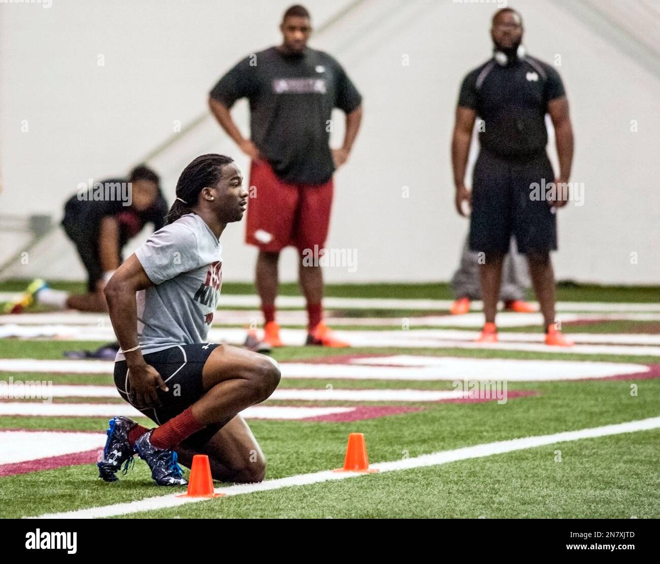 Arkansas receiver Cobi Hamilton, front, prepares to run a timed 40-yard ...