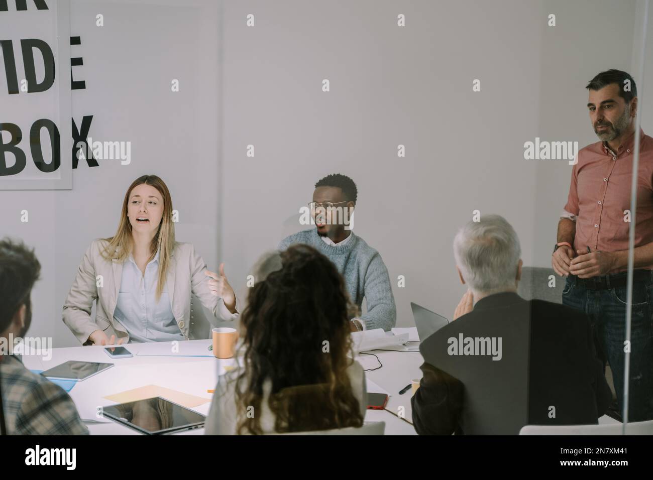 Paperwork results discuss between multiracial creative group of people ...