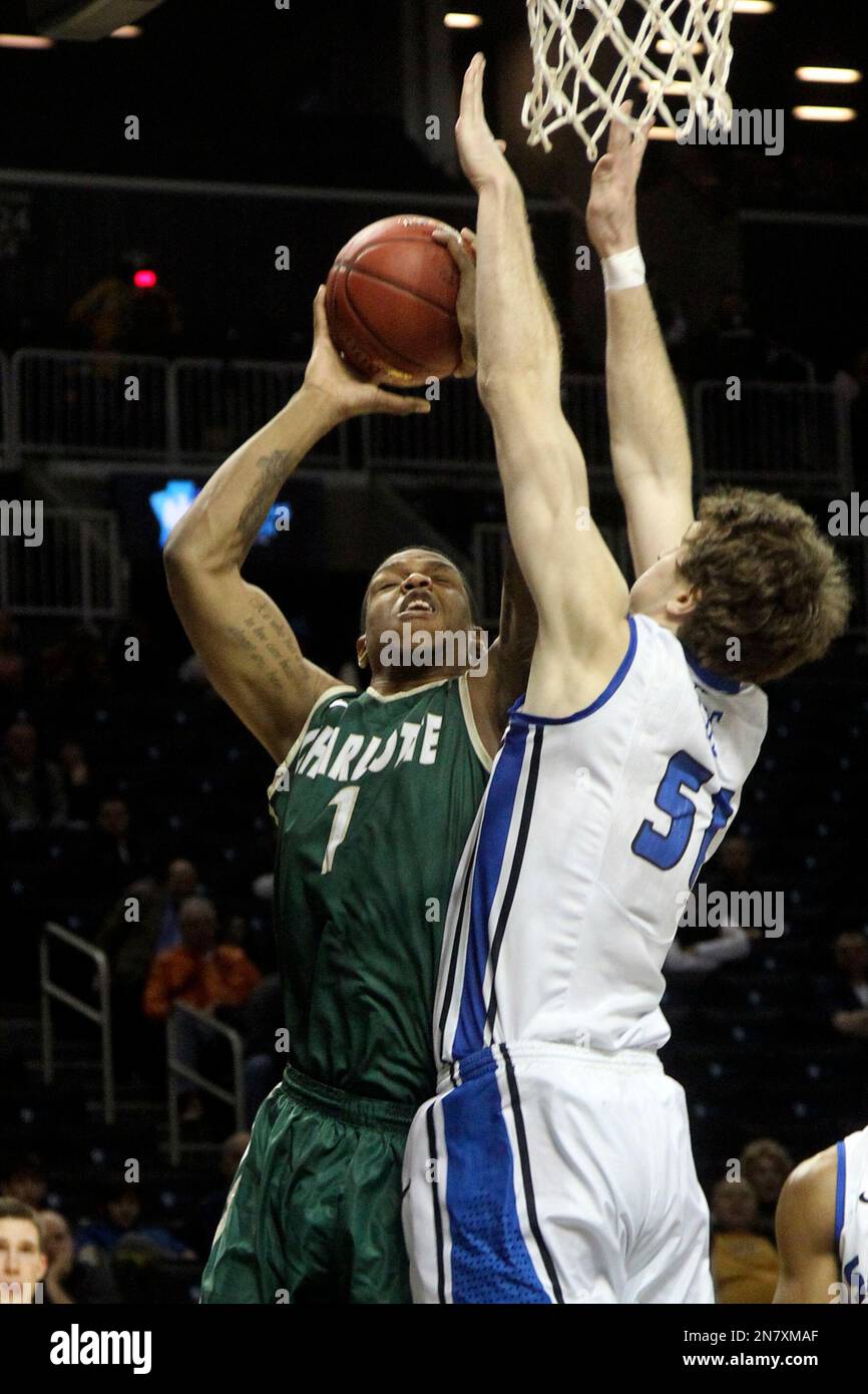 Charlotte's Darion Clark goes up past Saint Louis' Rob Loe during the ...