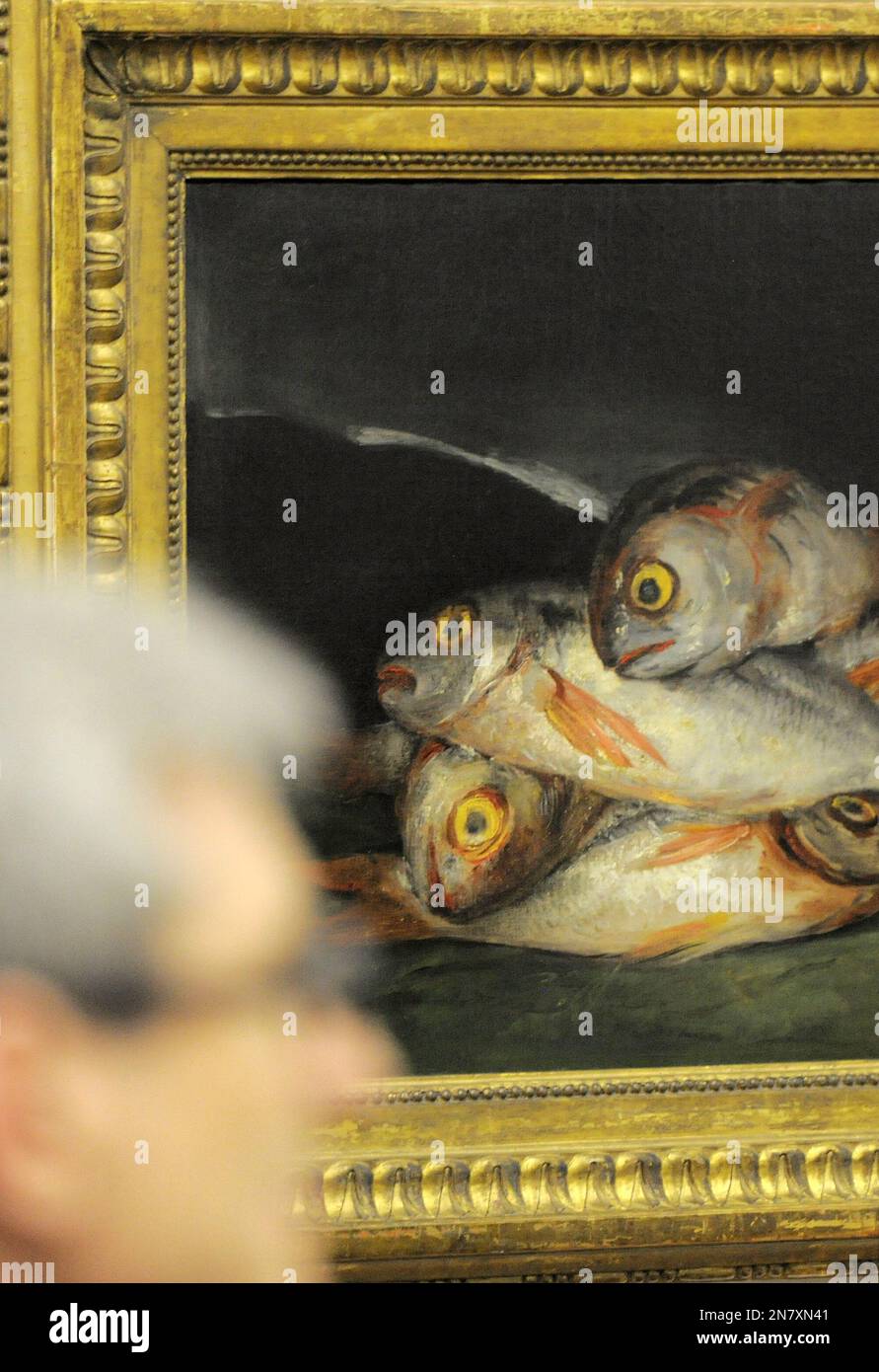 A man stands besides the painting 'Still-Life with golden bream' (1808/ ...