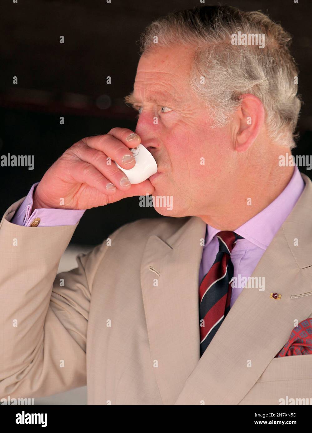 Britain's Prince Charles drinks a traditional Arabic coffee during his ...