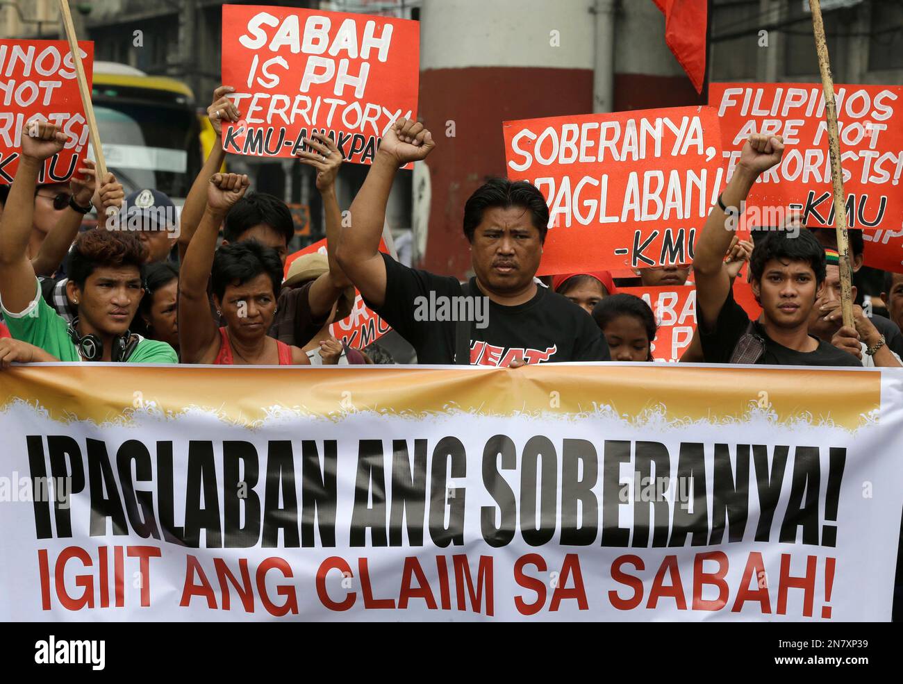 Protesters clench their fists during a rally near the Presidential ...