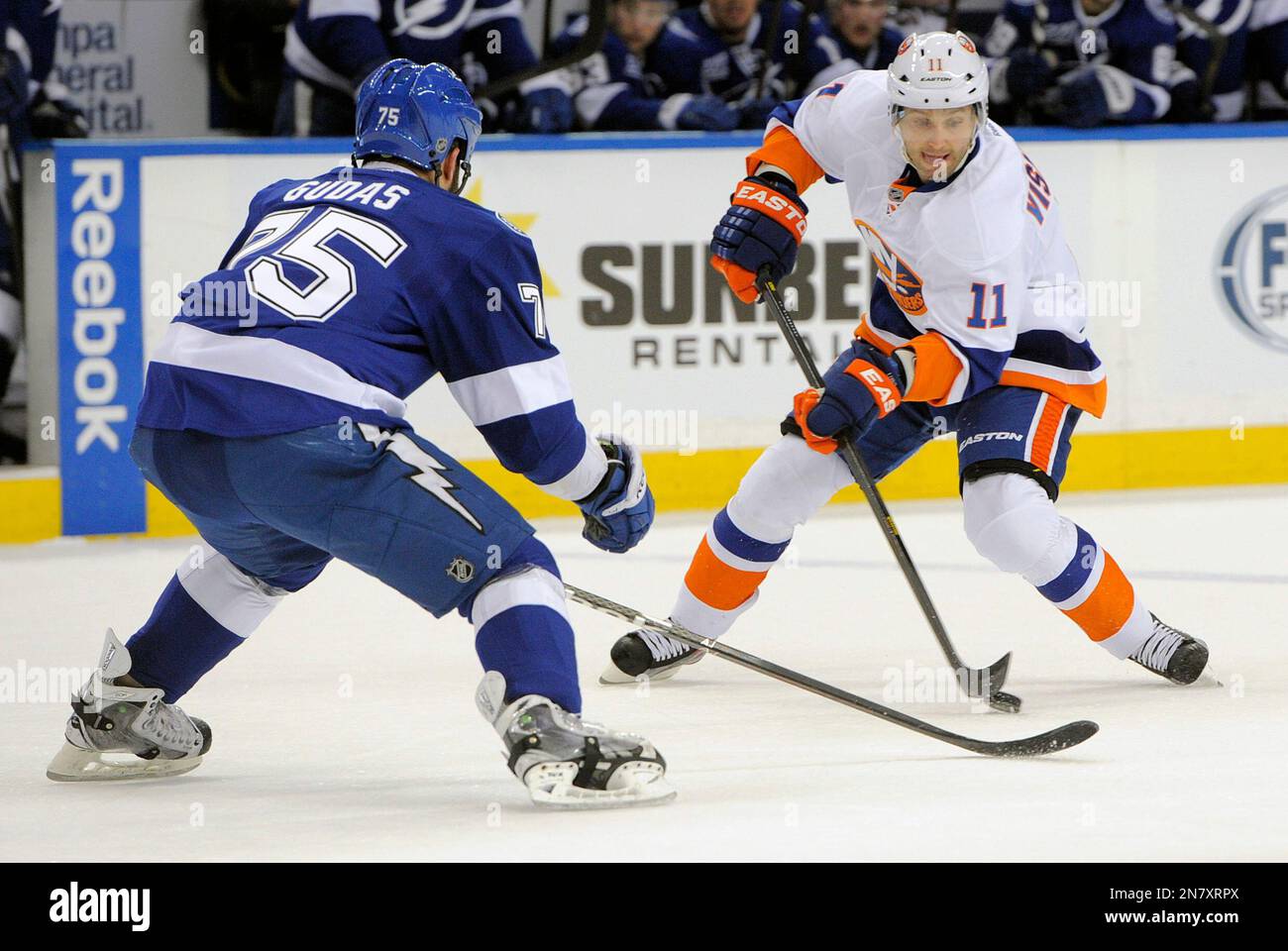 New York Islanders defenseman Lubomir Visnovsky (11) controls the puck ...
