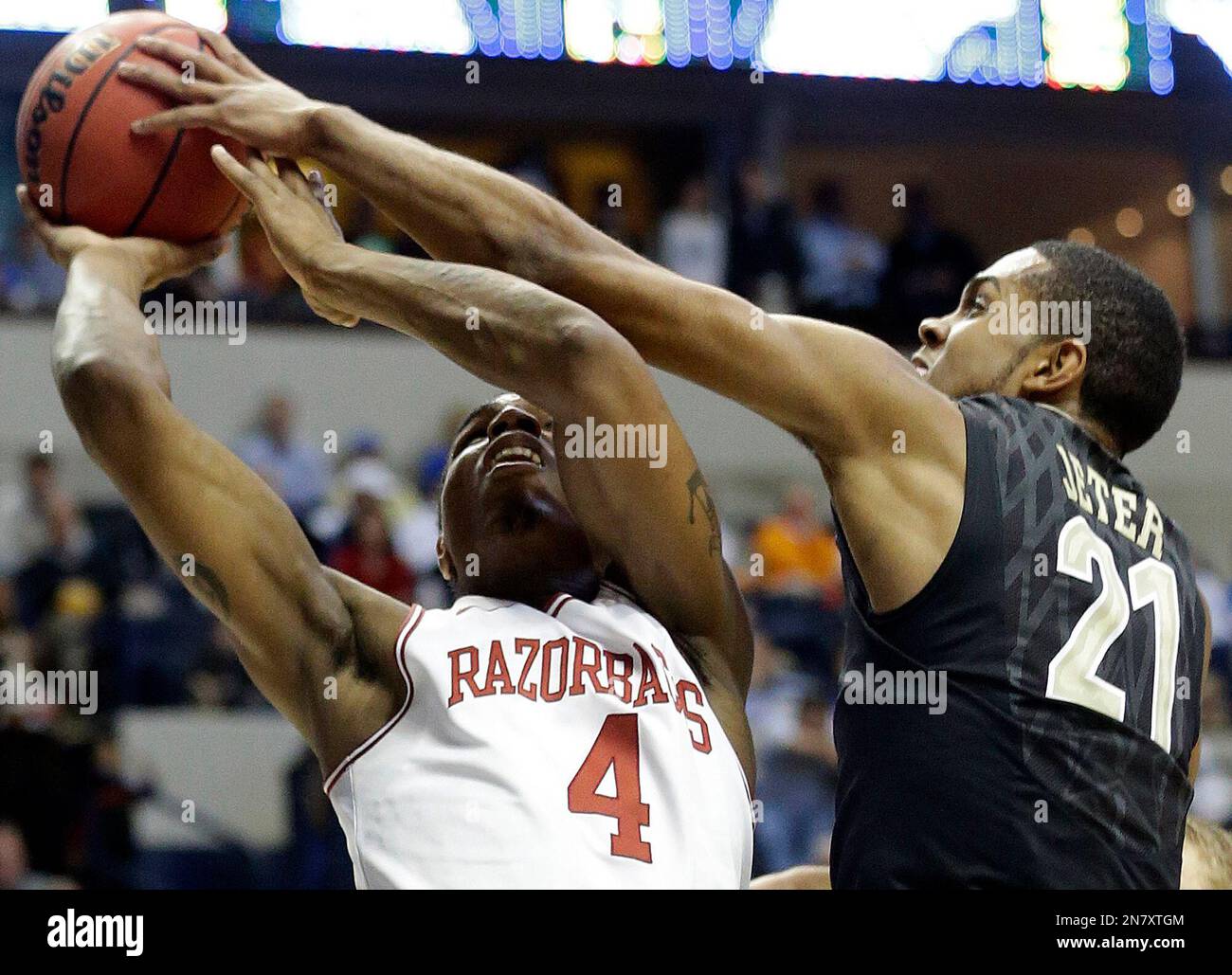 Arkansas forward Coty Clarke (4) shoots against Vanderbilt forward Sheldon Jeter (21) during the ...