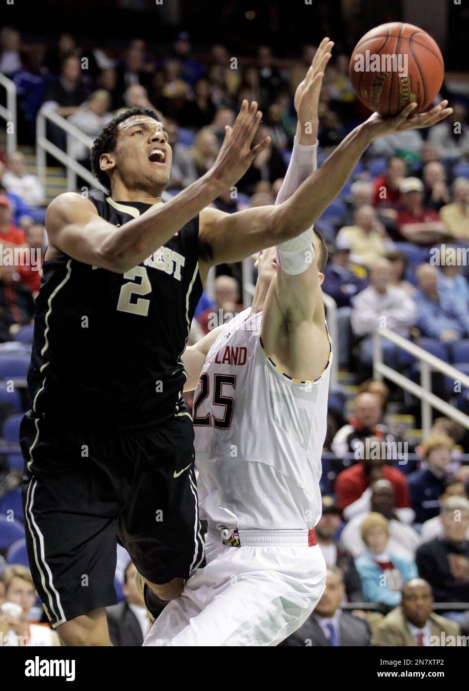 Wake Forest's Devin Thomas (2) drives past Maryland's Alex Len (25 ...