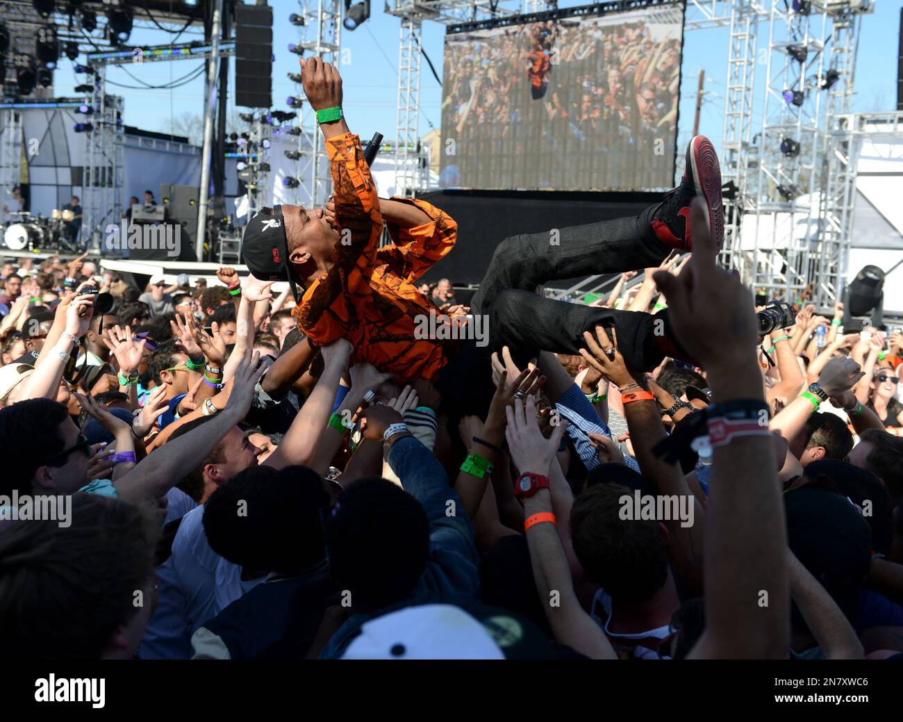 Rapper Travi$ Scott floats in the audience as he performs at the mtvU ...