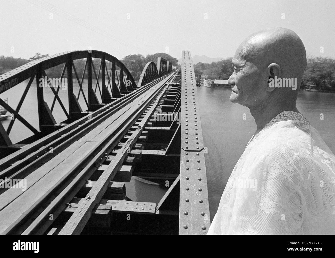 Takashi Nagase of Japan poses by the famous bridge over the River Kwai ...