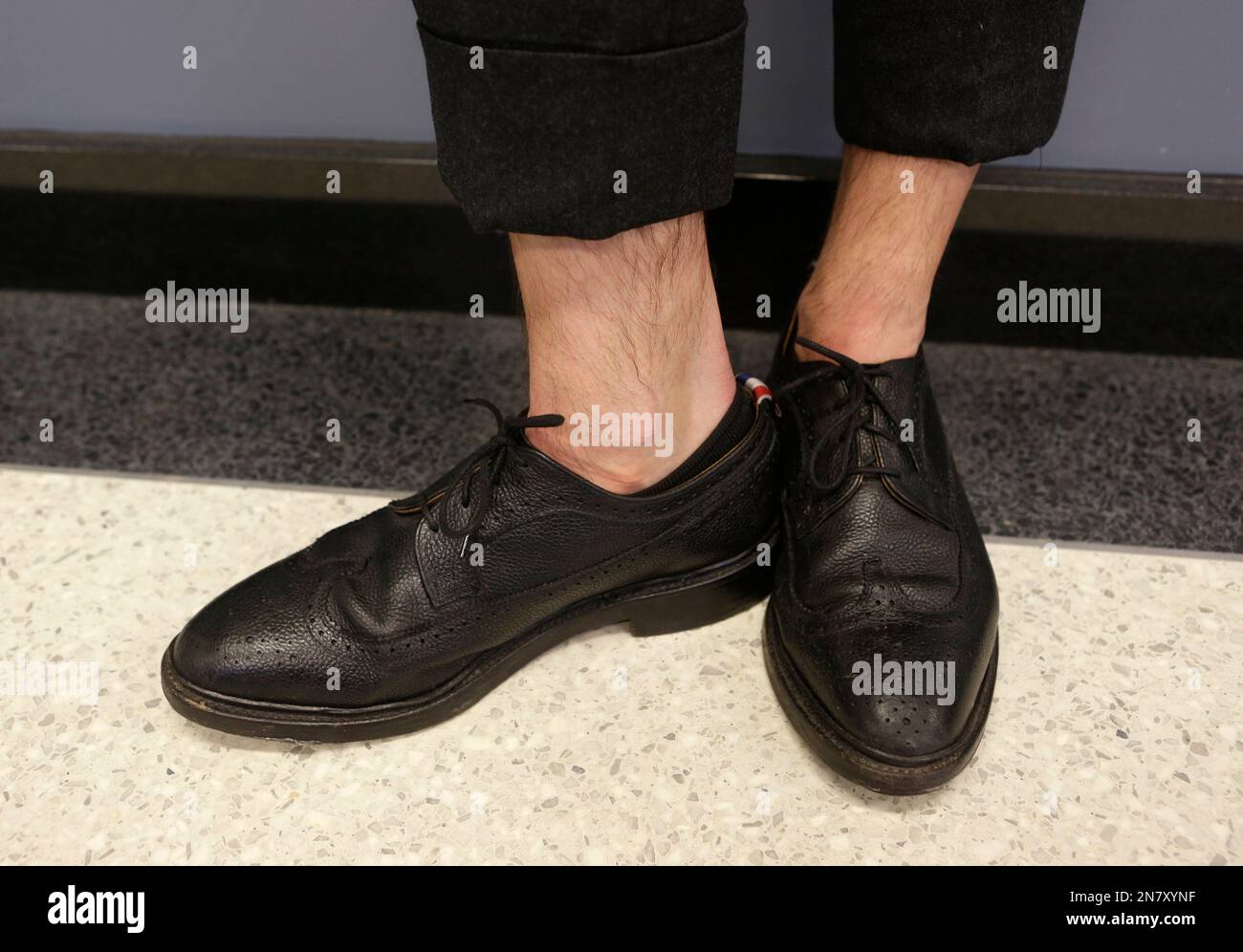 Fashion designer Thom Browne's sockless look is shown as he poses for a ...