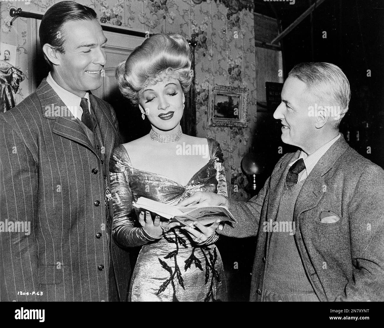 Robert Service, Poet-Laureate, right, reads the line from his famous ...
