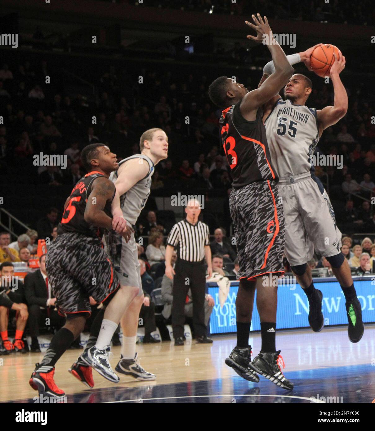 Georgetown's Jabril Trawick (55) goes up against Cincinnati's Cheikh ...
