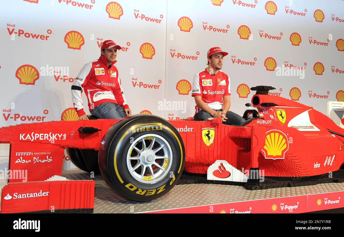 Ferrari driver Fernando Alonso of Spain, right, and teammate Felipe ...