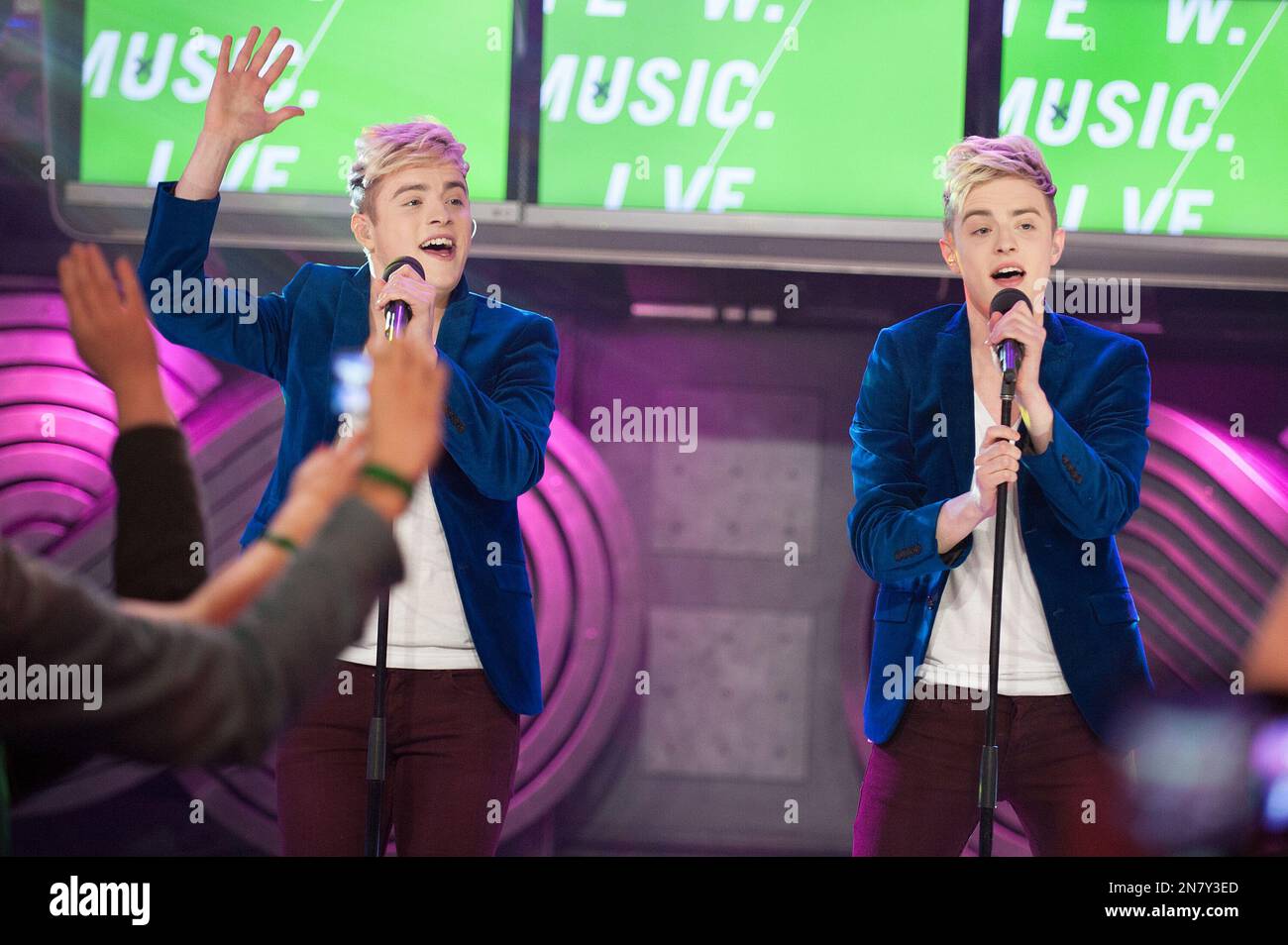 Singers John Grimes and Edward Grimes (aka Jedward) perform on-stage ...