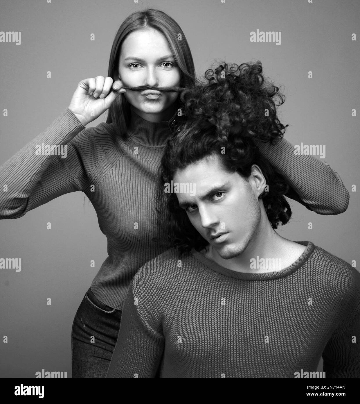 Beautiful girl playing with her boyfriend hair. Different types of hair ...