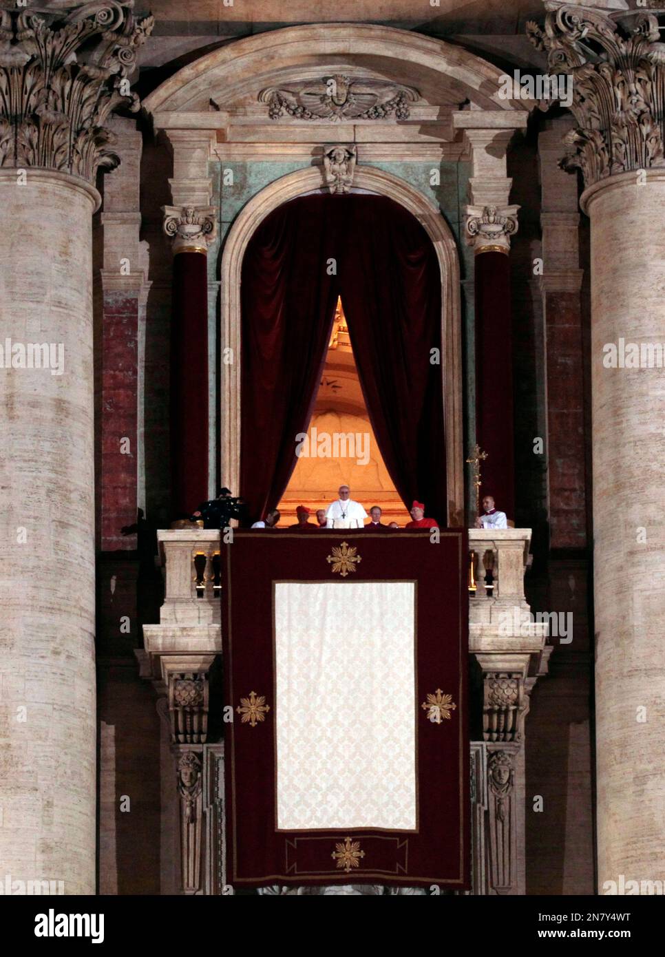 Pope Francis speaks to the crowd from the central balcony of St. Peter ...