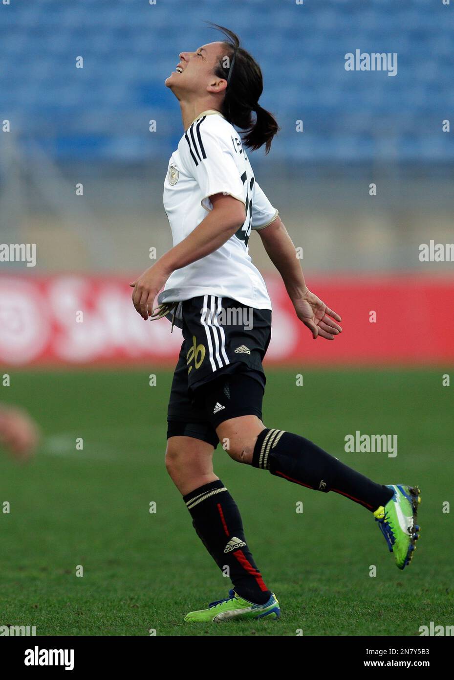 Germany's Nadine Kessler grimaces after being hit on her knee during ...