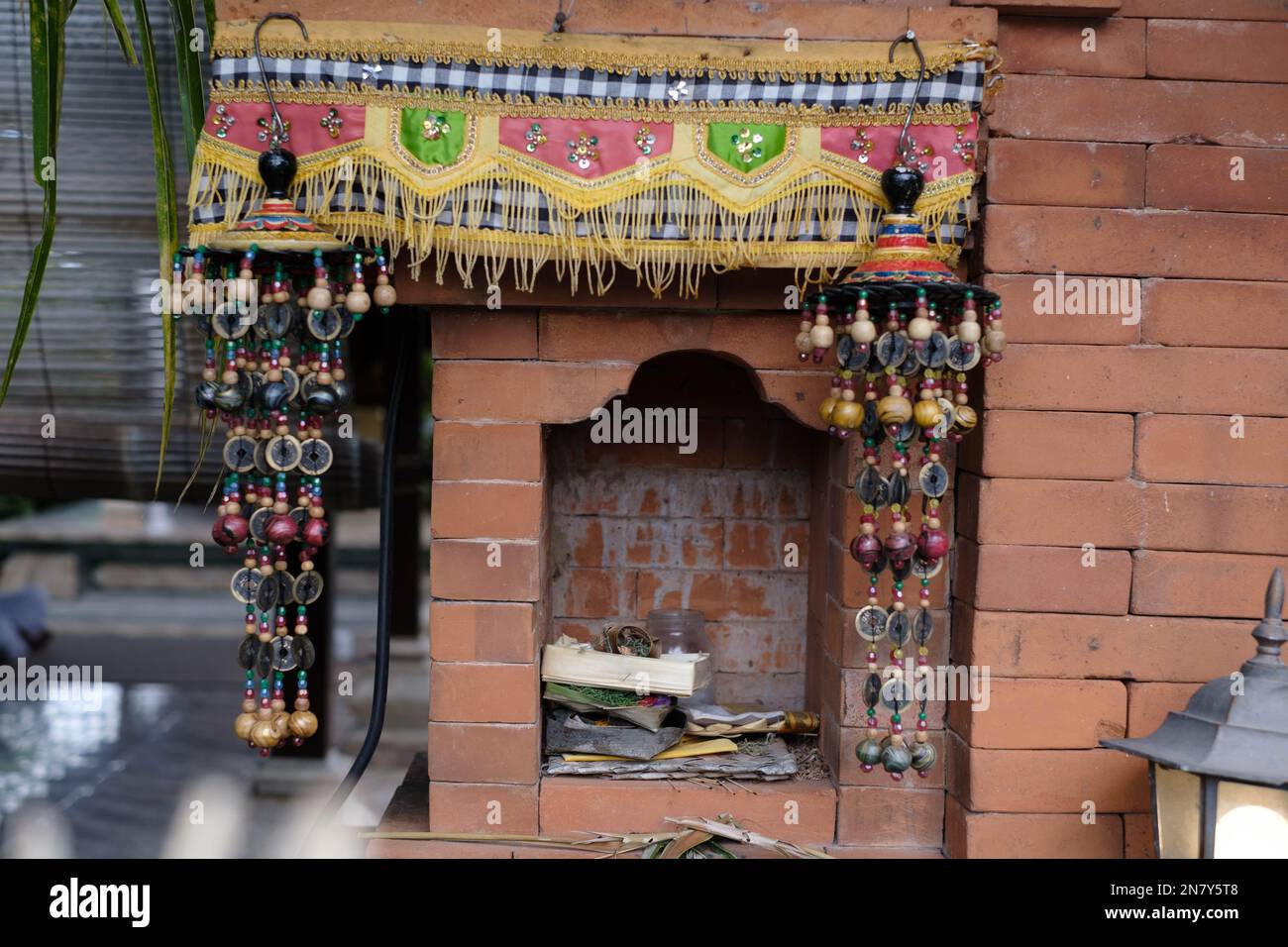 Traditional Balinese house of spirits made of brick covered by sacred ...