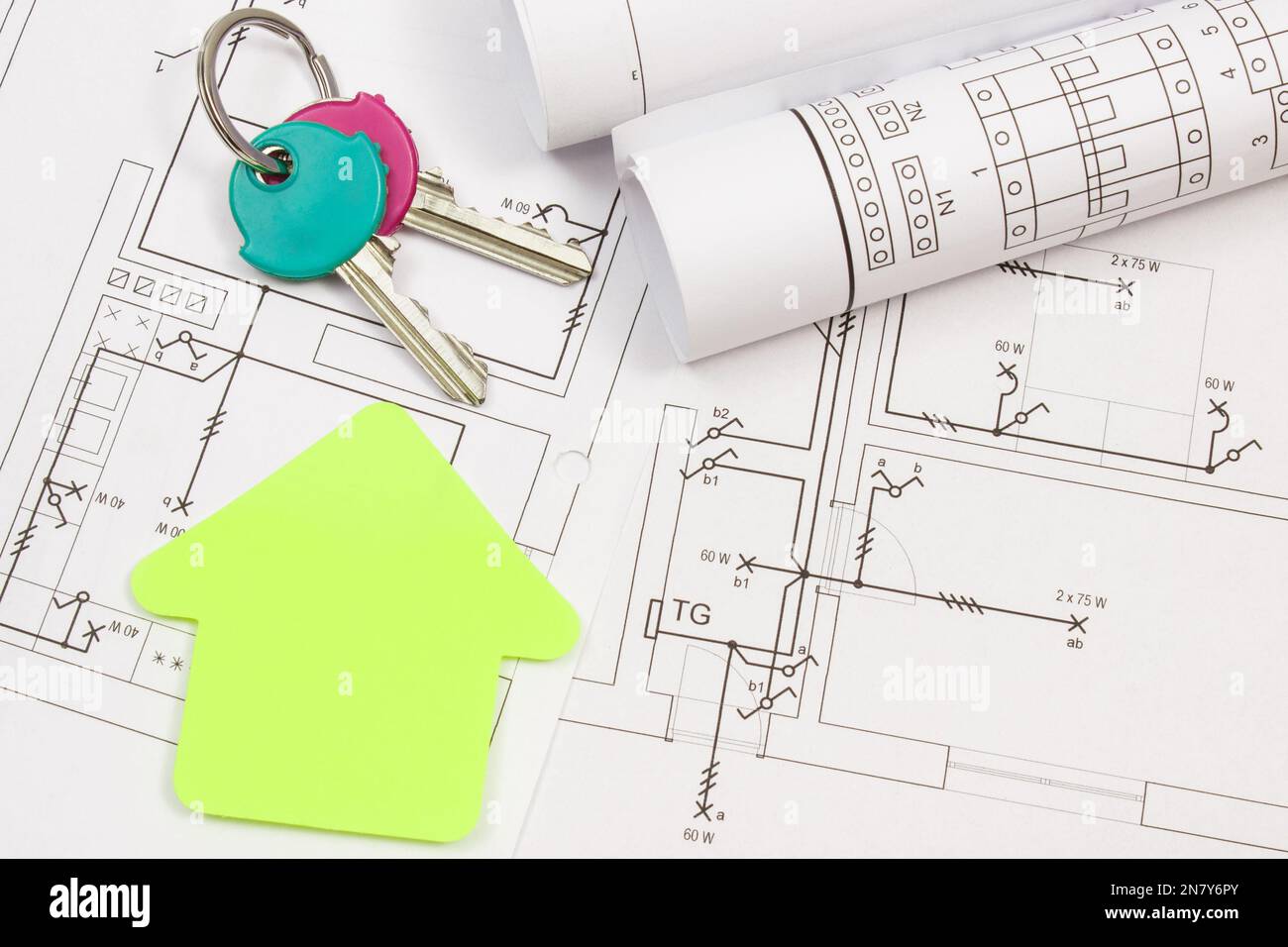 House shape made of paper, home keys and electrical construction ...