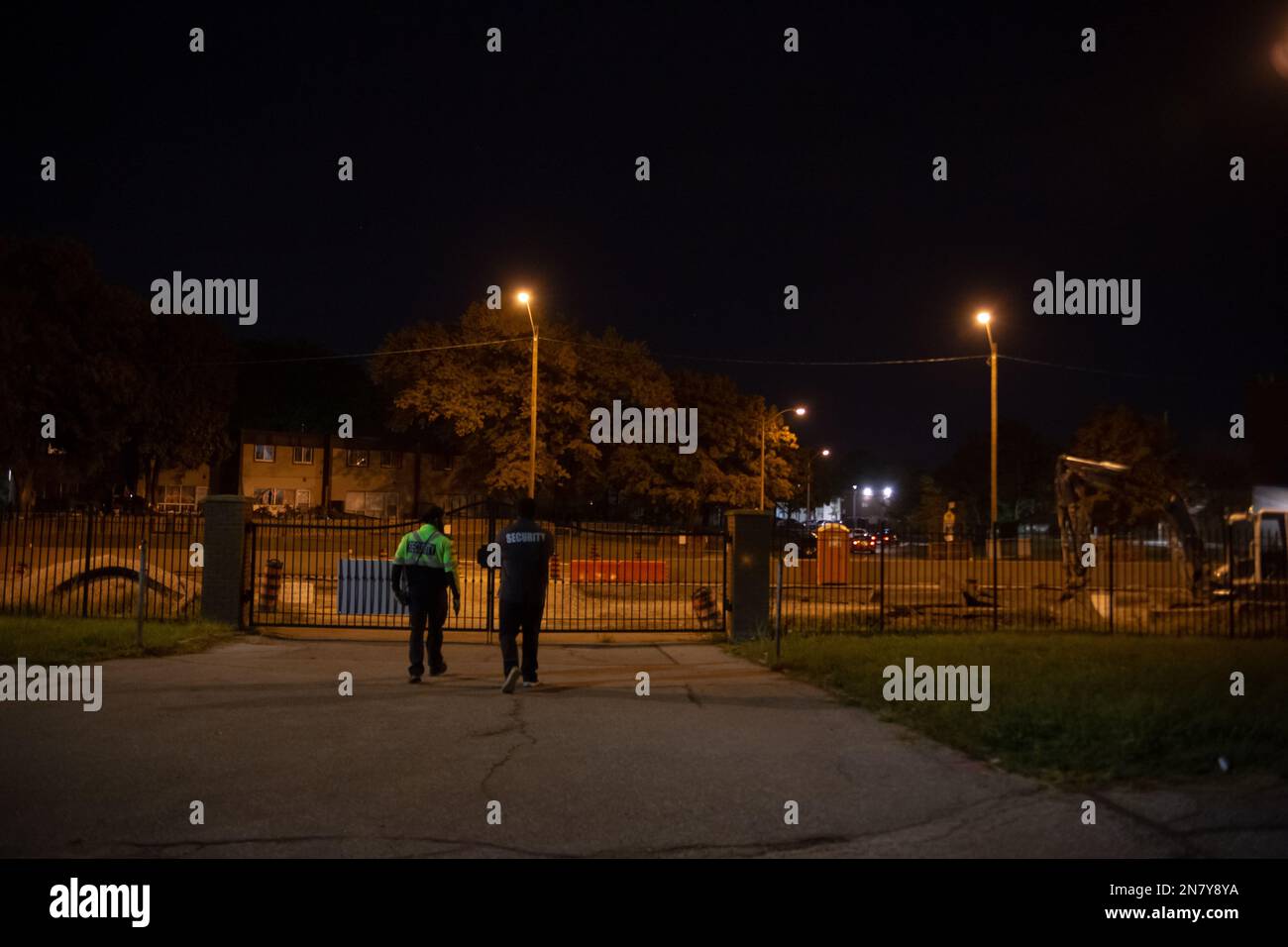 A back view of security workers Stock Photo - Alamy