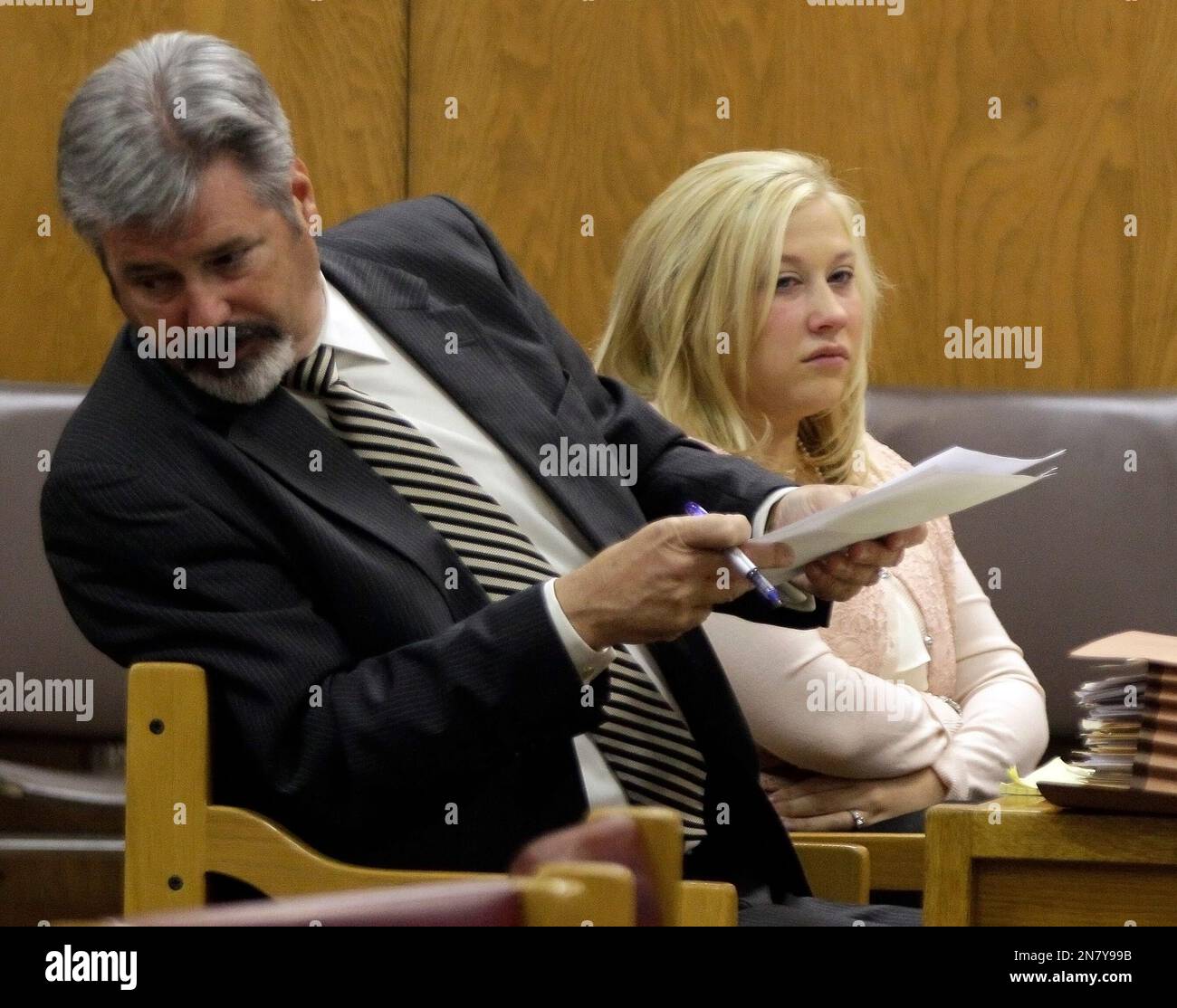 FILE - In this Oct. 25, 2011 file photo, Lindsey Lowe, right, sits with ...