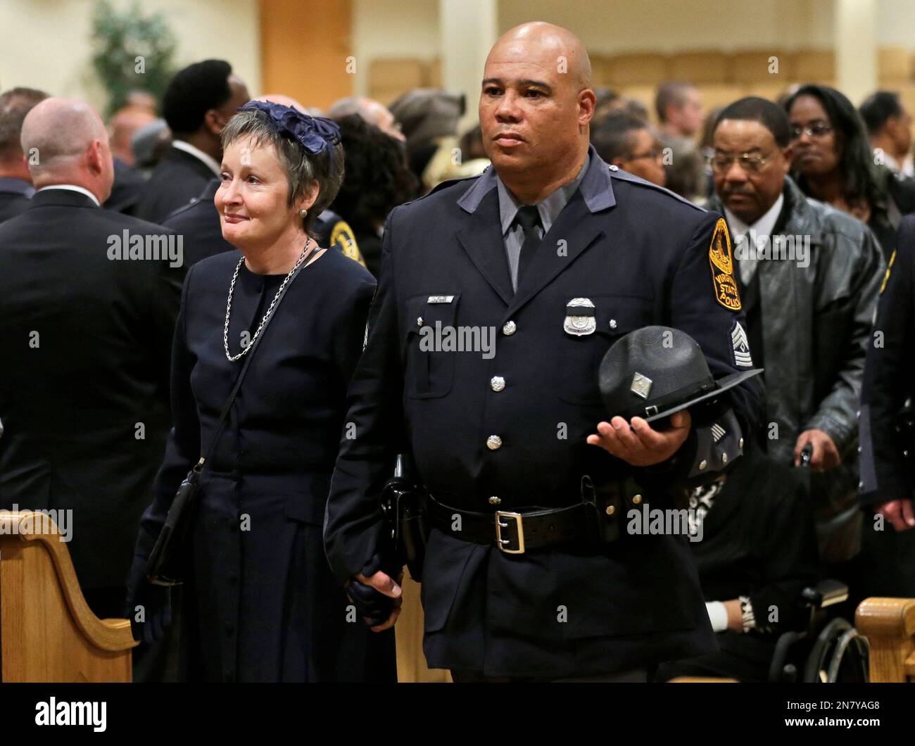 Betty Walker, left, wife of Virginia State Trooper Junius A. Walker, is ...