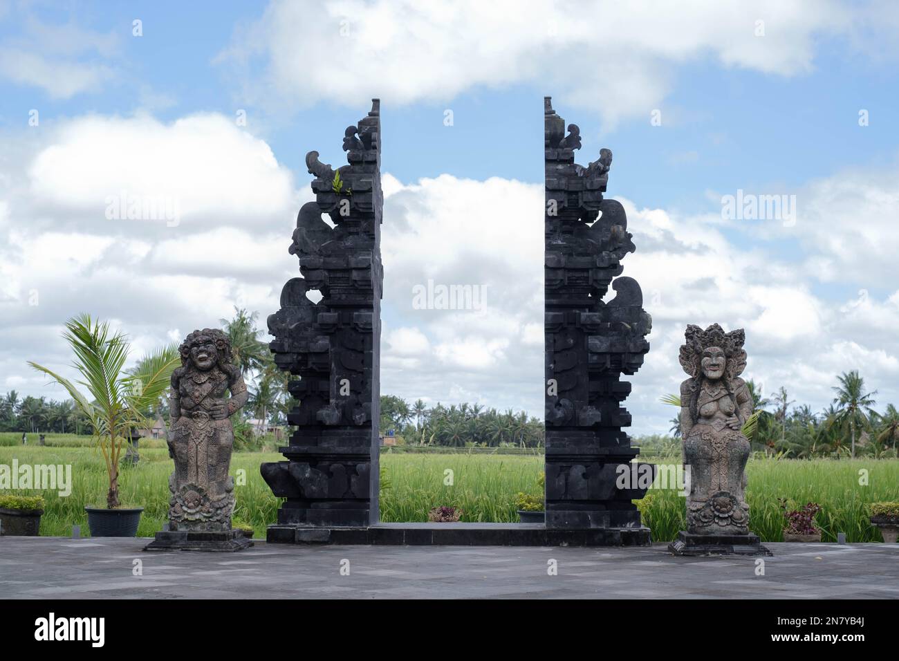 Balinese mini gate building or usually called Gapura with statue made ...