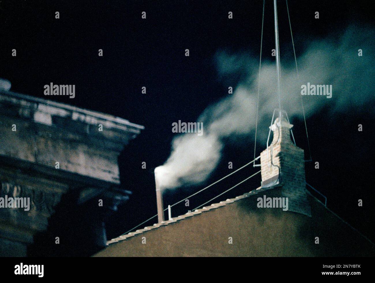 Smoke rises from the Vatican conclave as the Cardinals vote for a new ...
