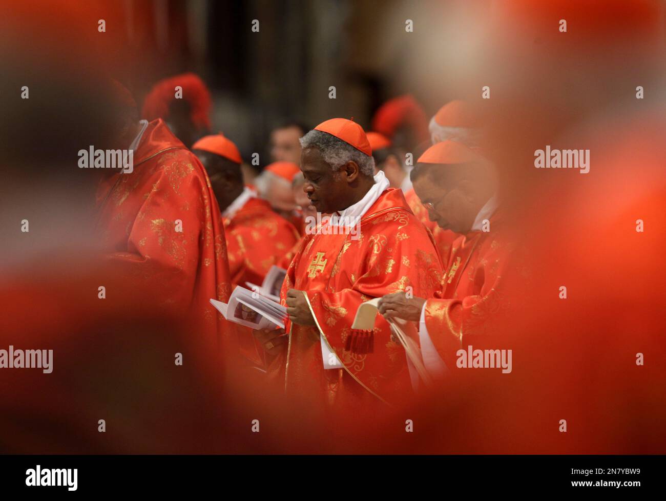 Ghanaian Cardinal Peter Kodwo Appiah Turkson, center, attends a Mass ...