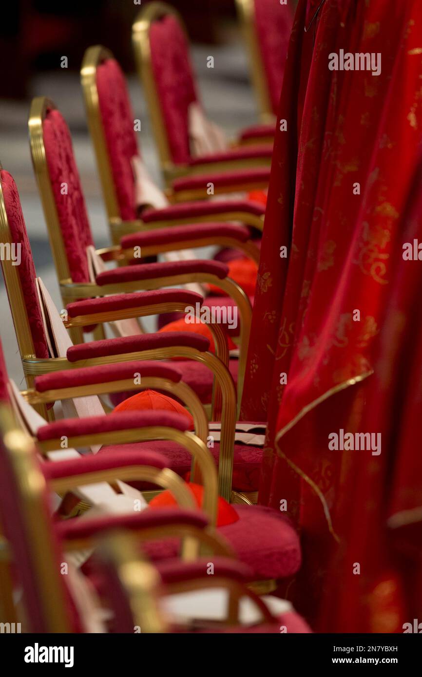Cardinal skull caps are seen on chairs during a Mass for the election ...