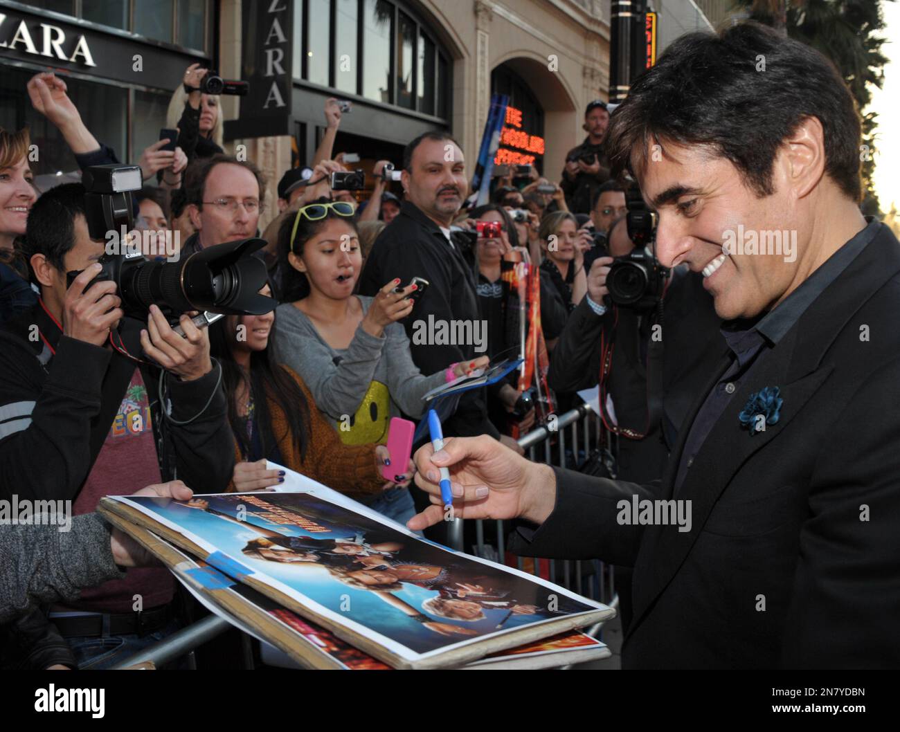 Illusionist David Copperfield signs autographs as he arrives at the LA ...