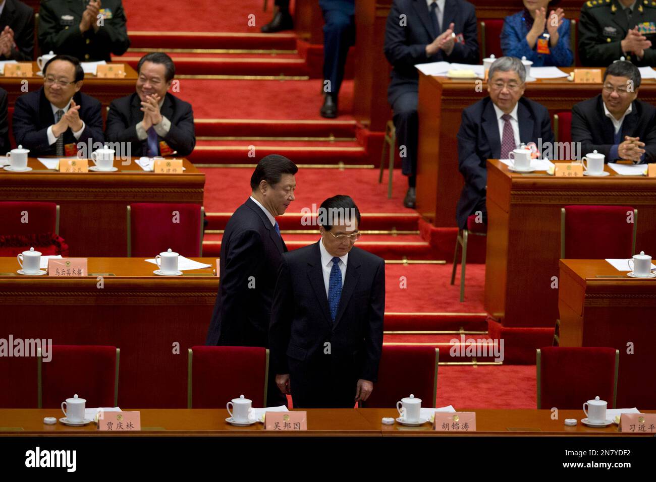 Delegates clap while Chinese Communist Party chief and incoming ...