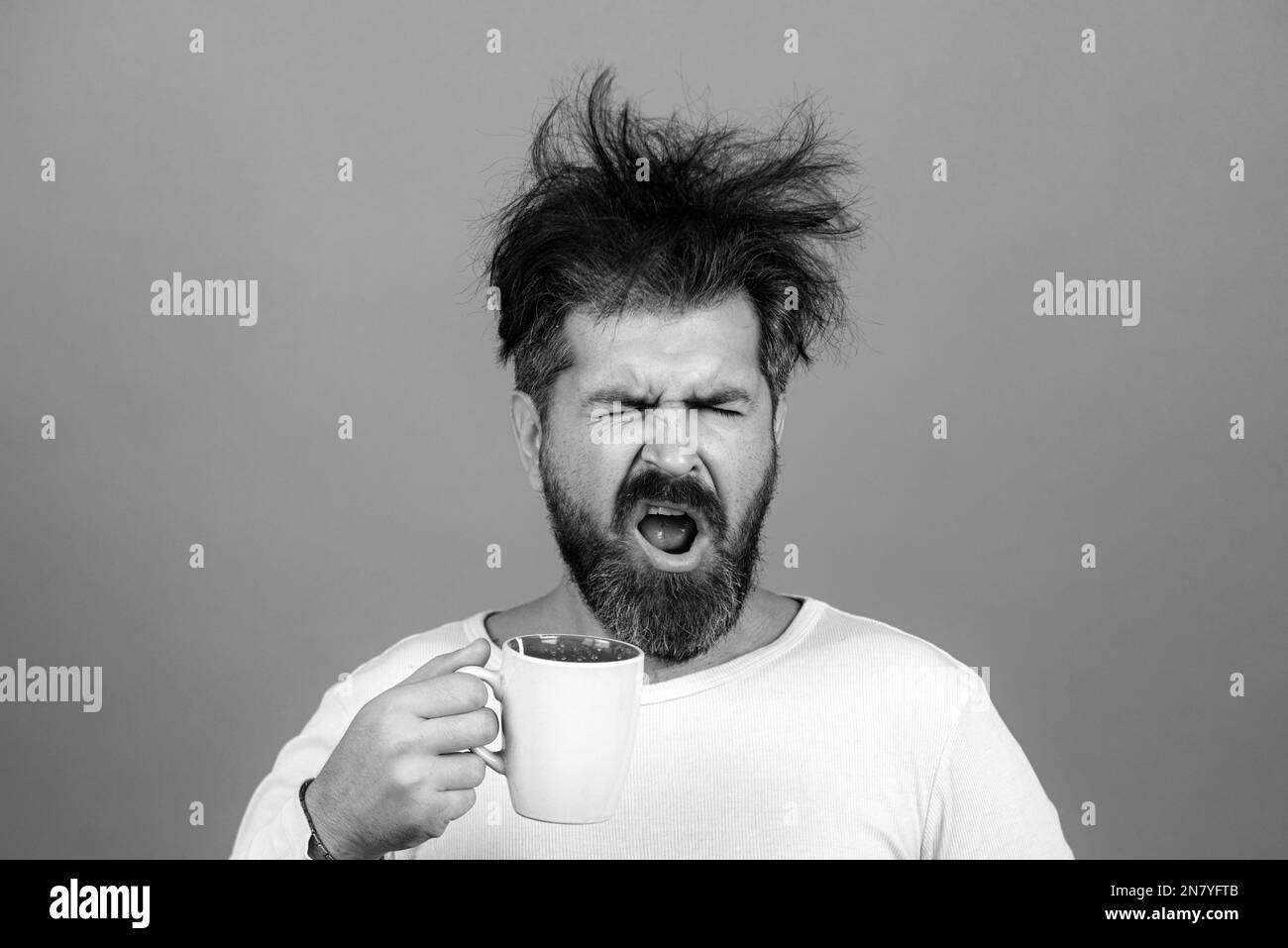 Man drinking coffee. Morning guy, wake up early in the morning on day ...