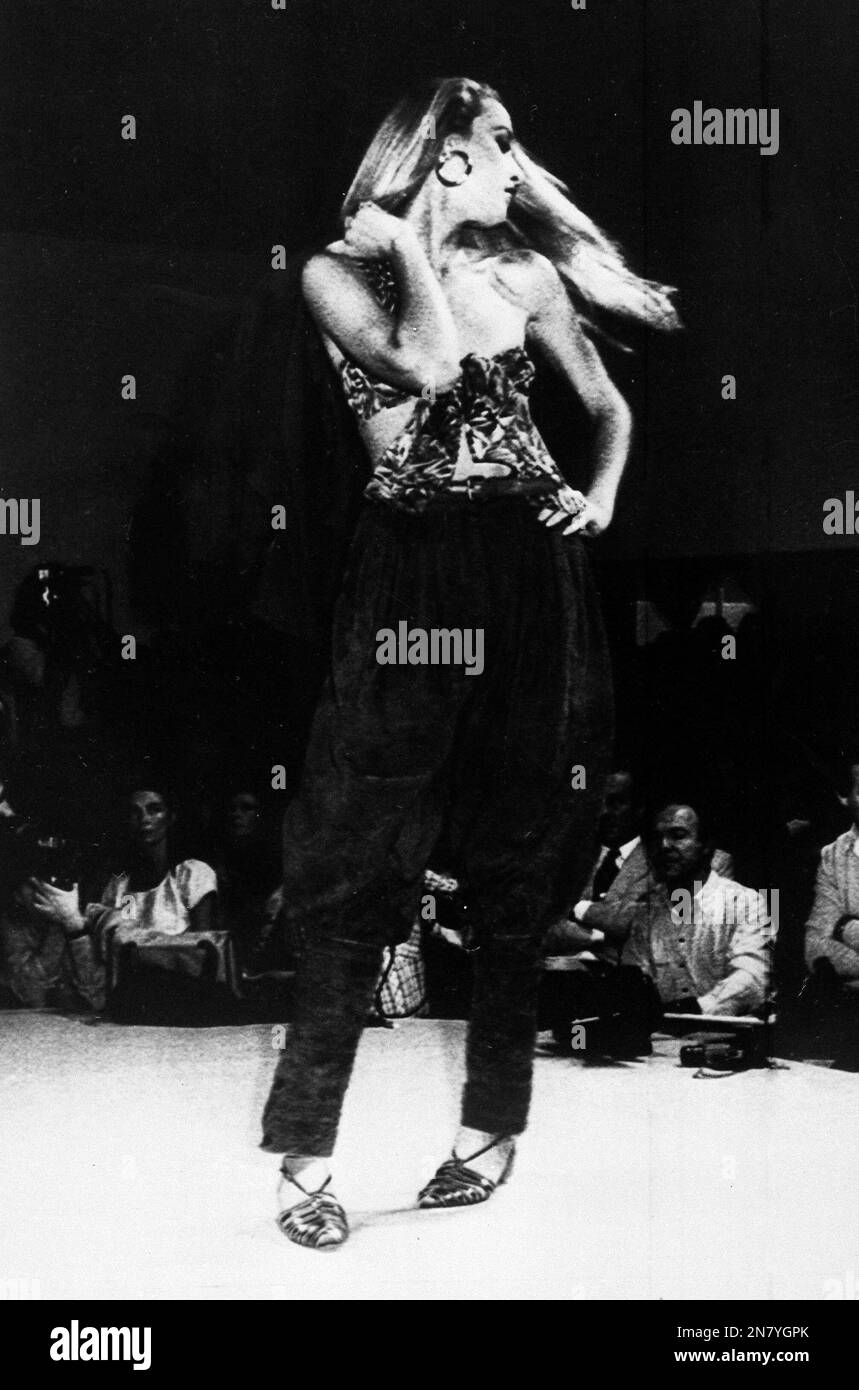 Top U.S. model Jerry Hall shows off a cherry red suede jolhpur suit ...