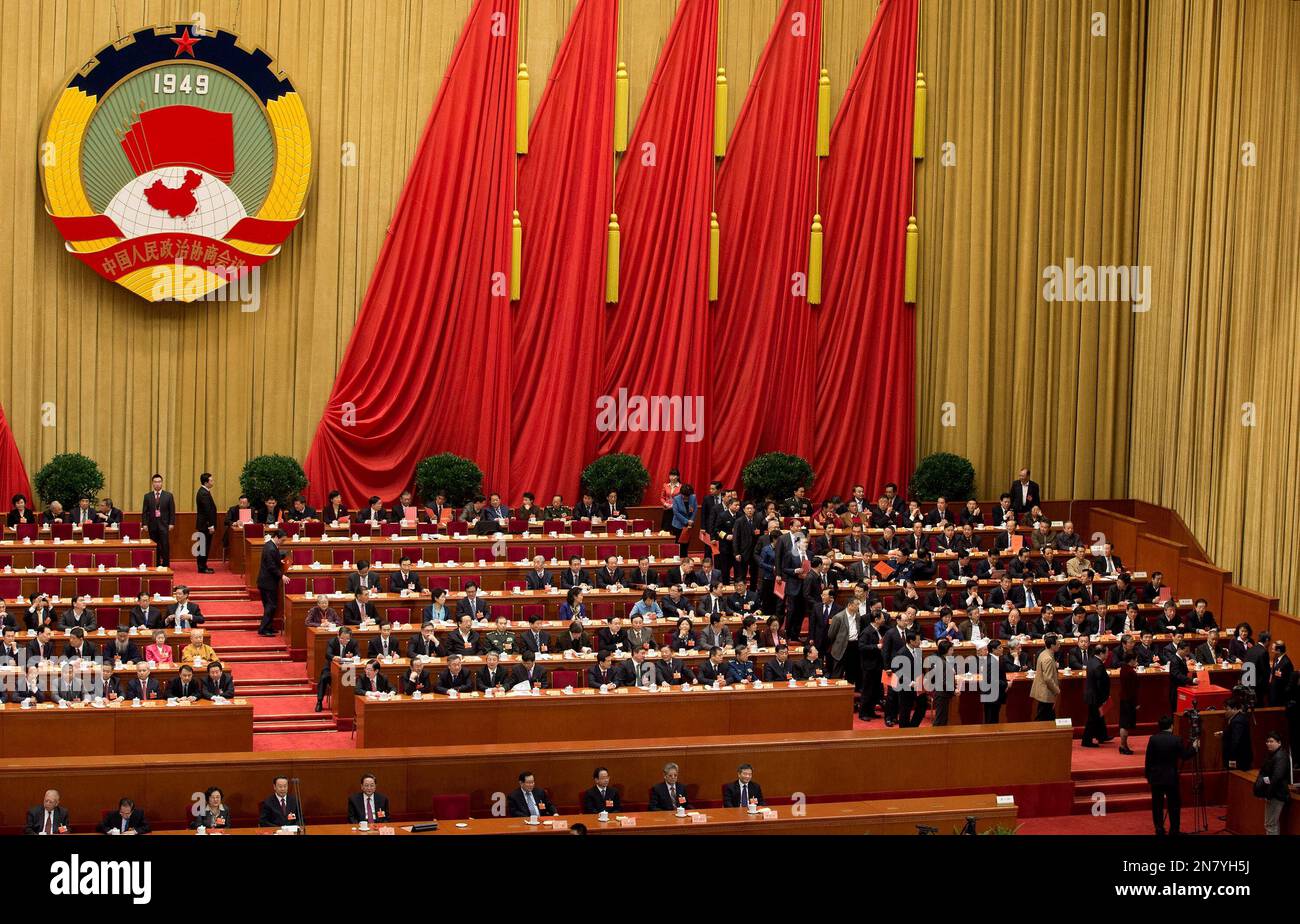 Delegates line up to cast their votes during a plenary session of the ...