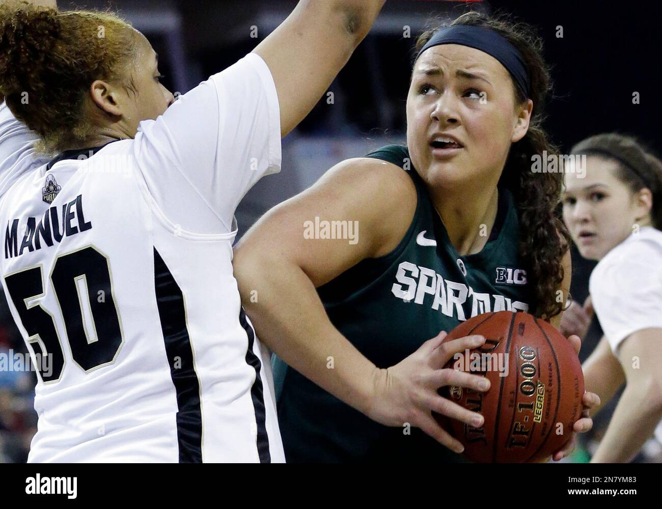 Michigan State center Jasmine Hines, right, looks to the basket as ...