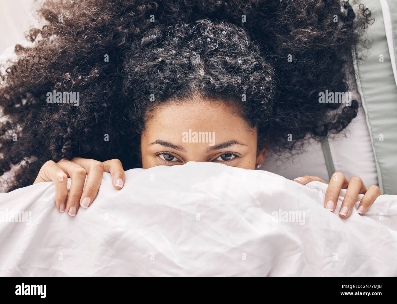 Girl sleeping under covers hi-res stock photography and images - Alamy