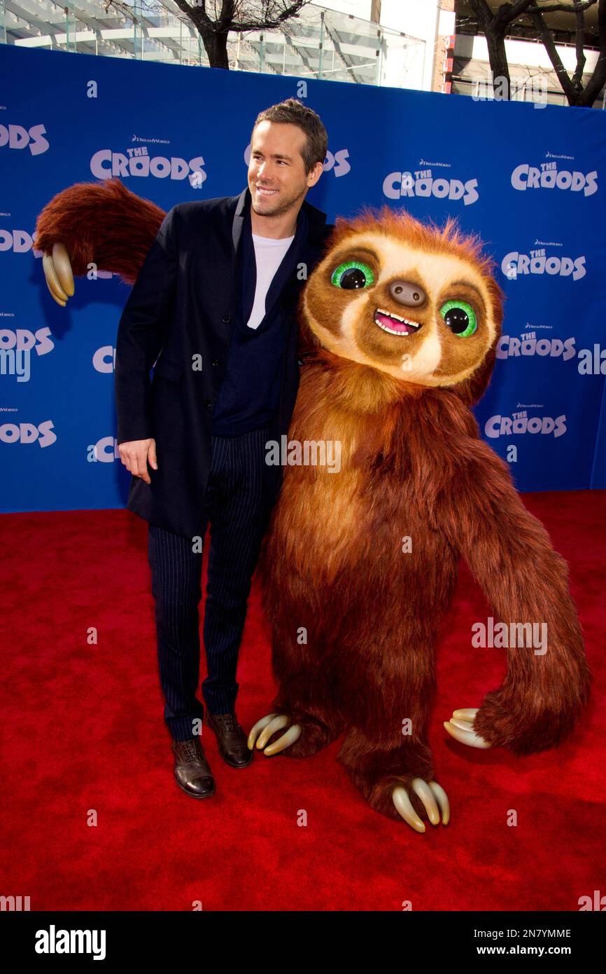 Ryan Reynolds poses with Belt the sloth at "The Croods" premiere on ...
